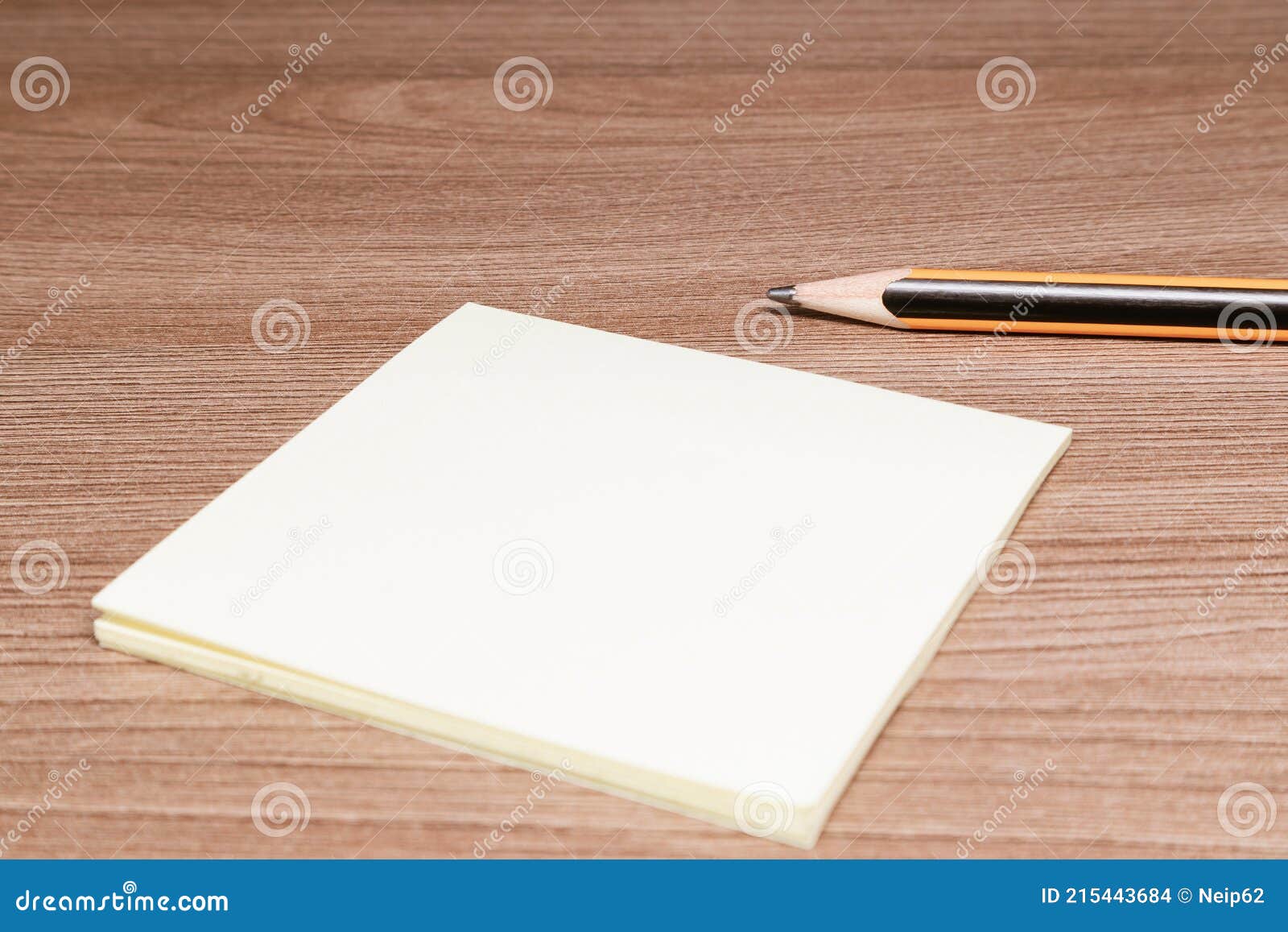 A Pencil and Sticky Notes Stand on a Wooden Table Stock Photo - Image ...