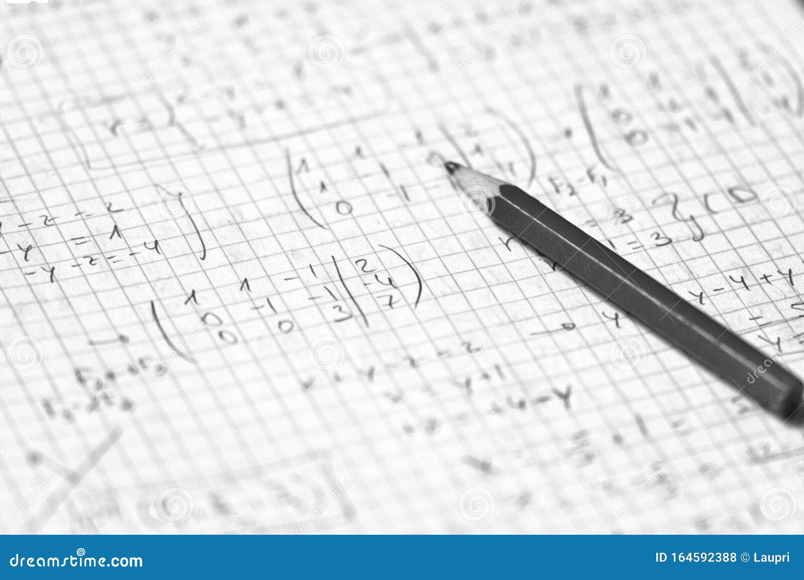 A Pencil and a Student Notebook with Math Exercises Stock Photo - Image ...