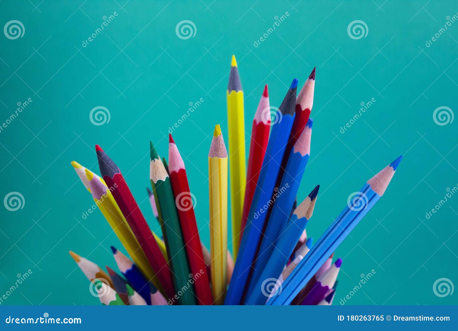 Pencils for Drawing Different Colors on a Green Background. Stock Image ...