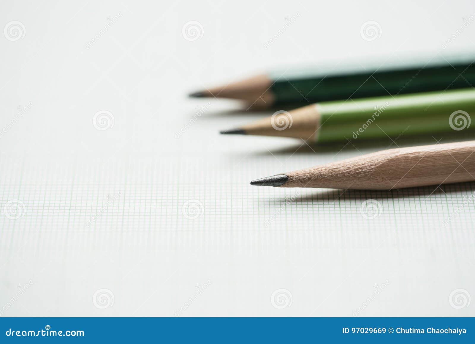 Pencils on graph paper stock image. Image of research - 97029669