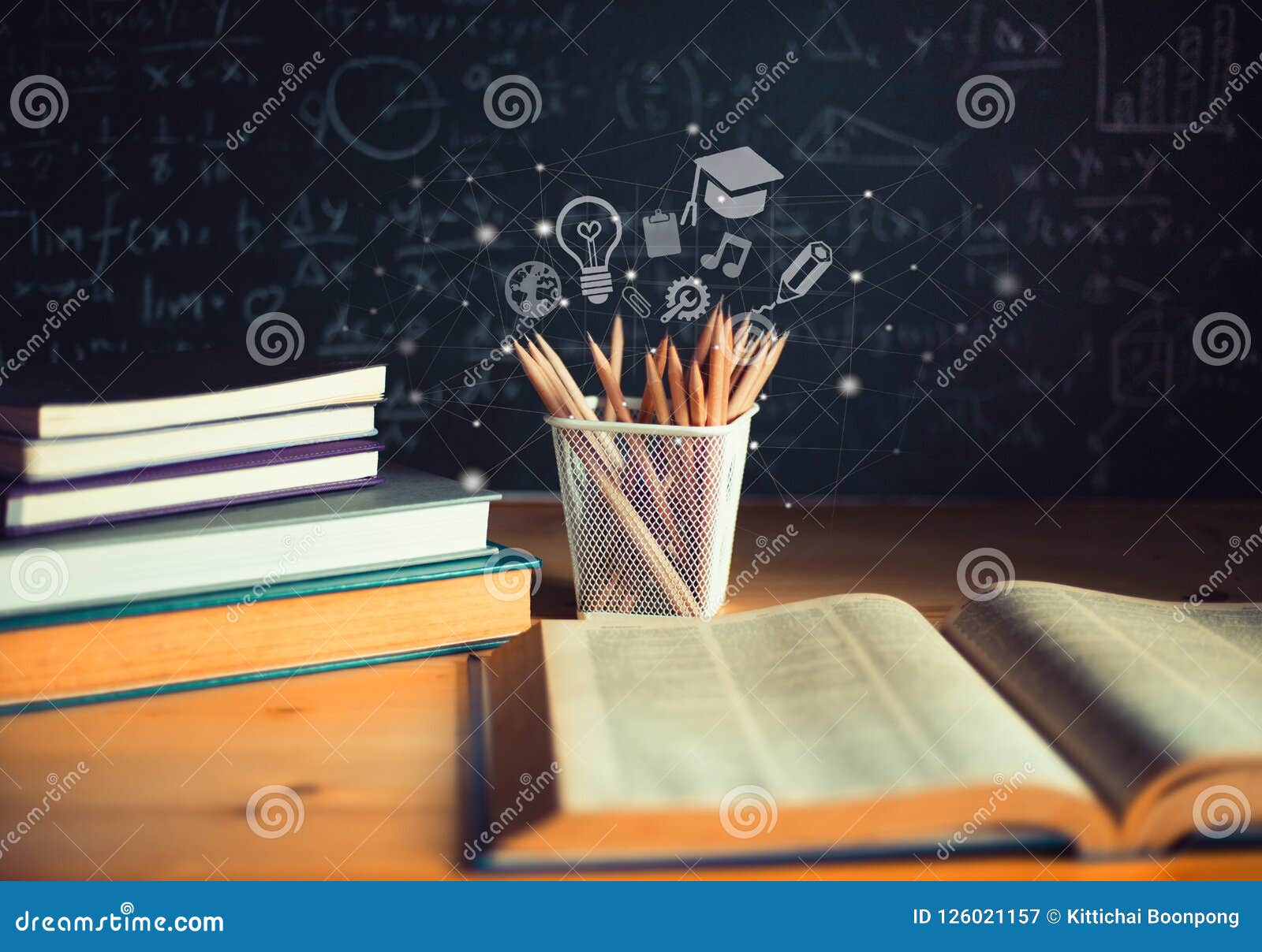 Pencils And Open Books With Formulas On The Chalkboard .education ...