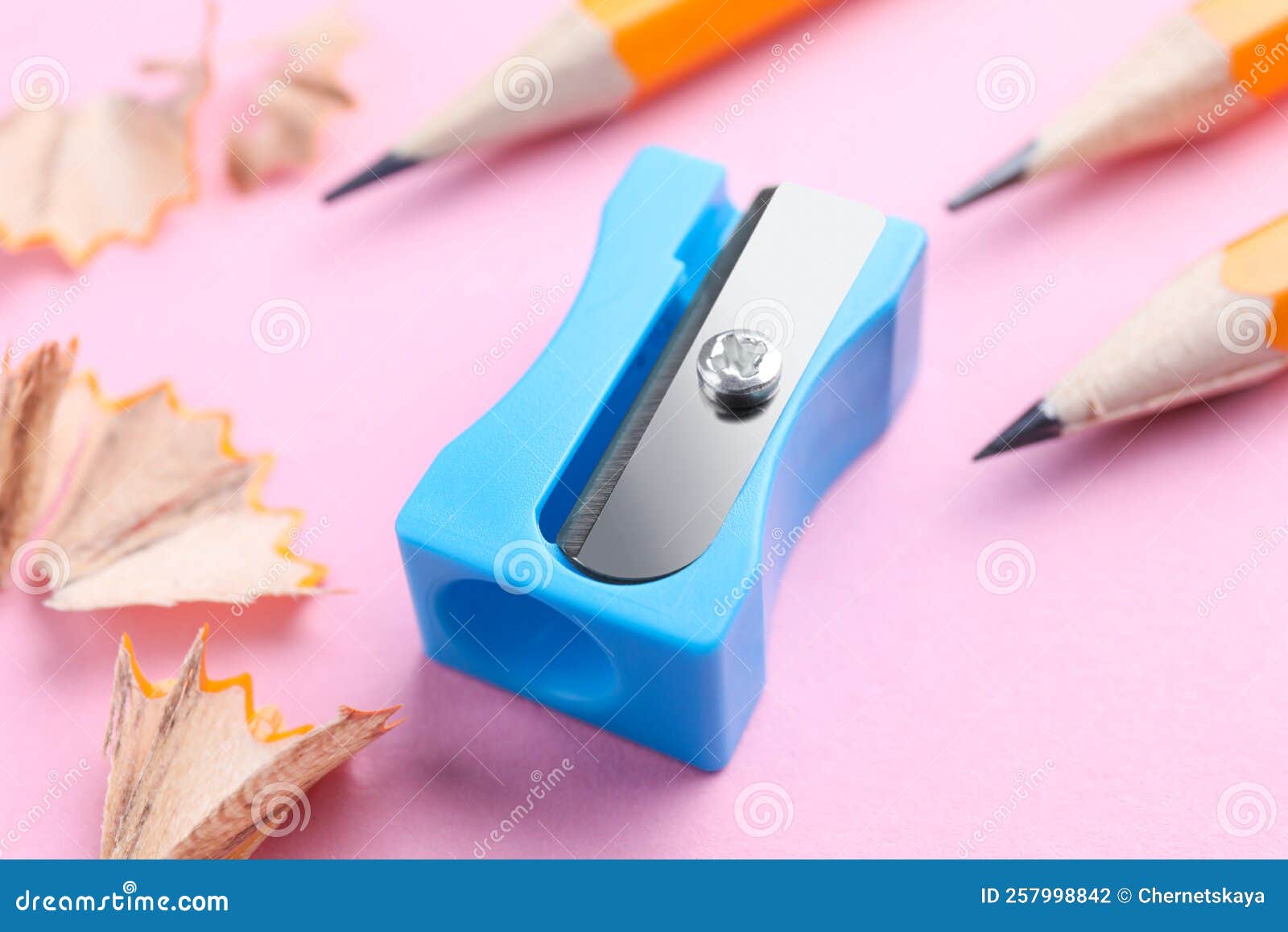 Pencils, Sharpener and Shavings on Pale Pink Background, Closeup Stock ...