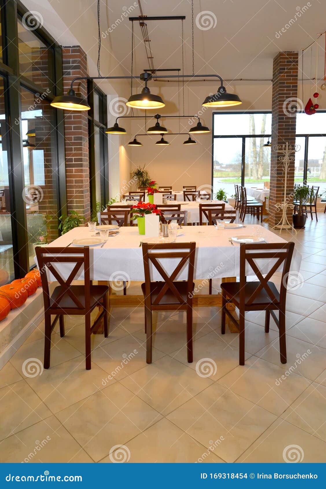 Pendant Metal Lights Above Tables in a Restaurant Stock Photo - Image ...