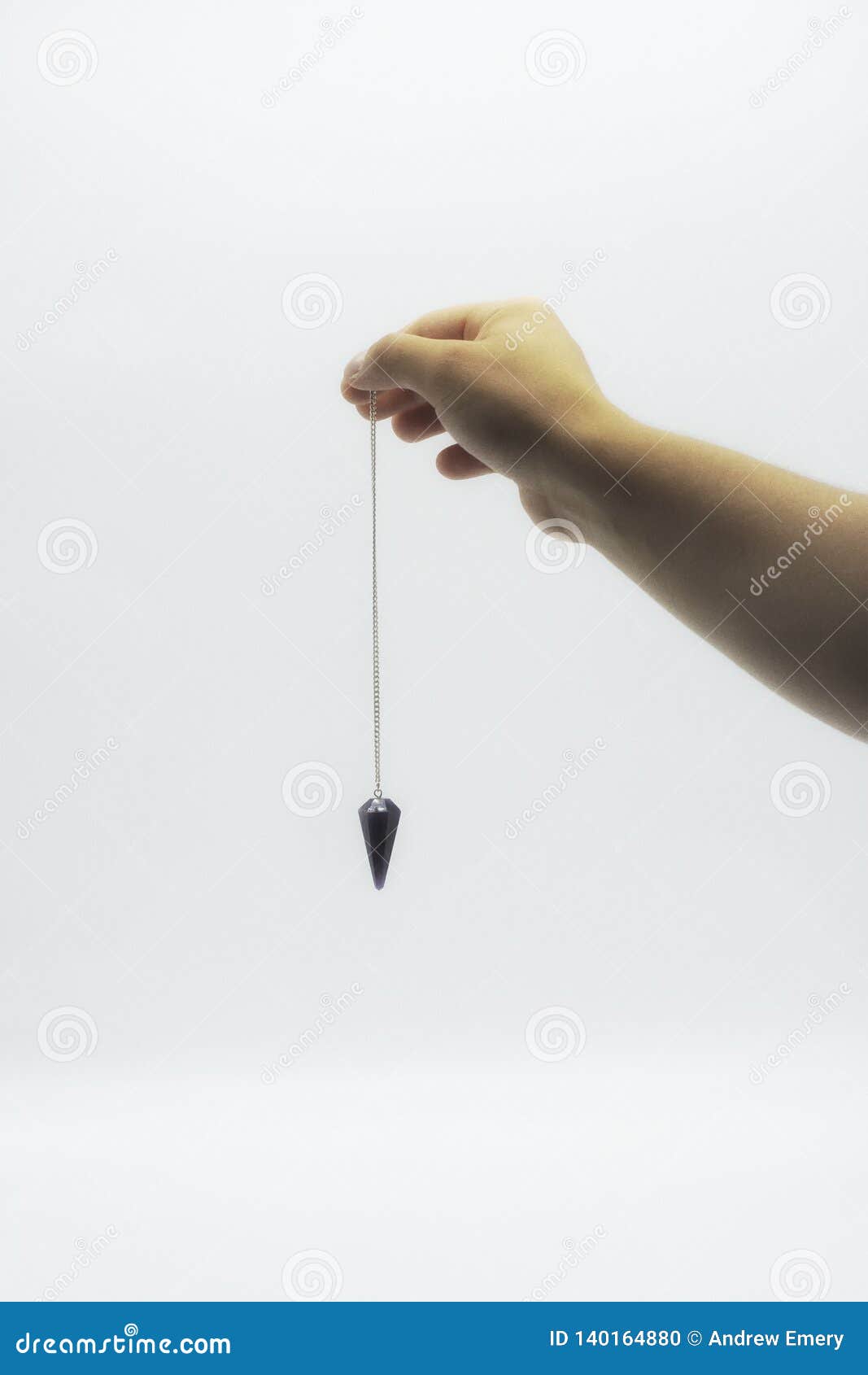 Pendulum Dowsing On An Isolated White Background With An Blue Crystal ...