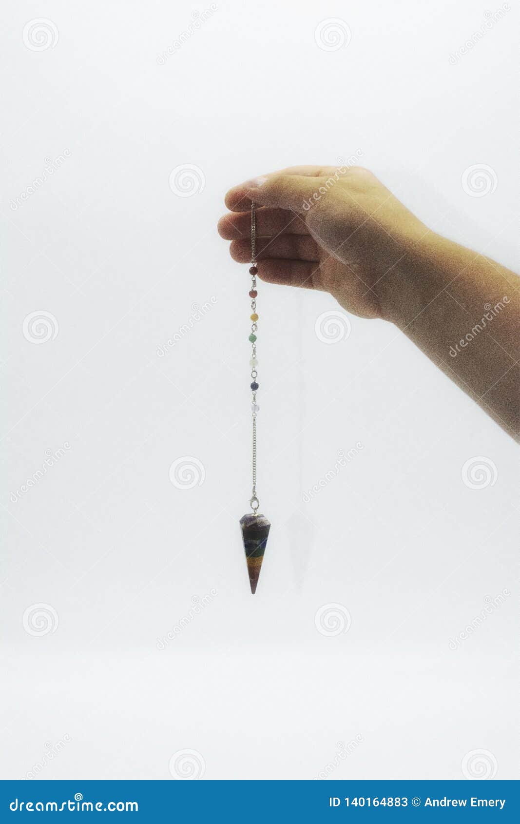 Pendulum Dowsing On An Isolated White Background With A Turquoise ...