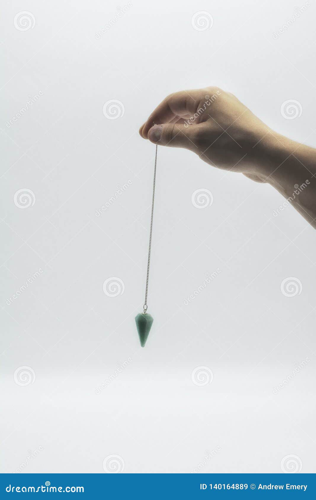 Pendulum Dowsing On An Isolated White Background With A Turquoise ...