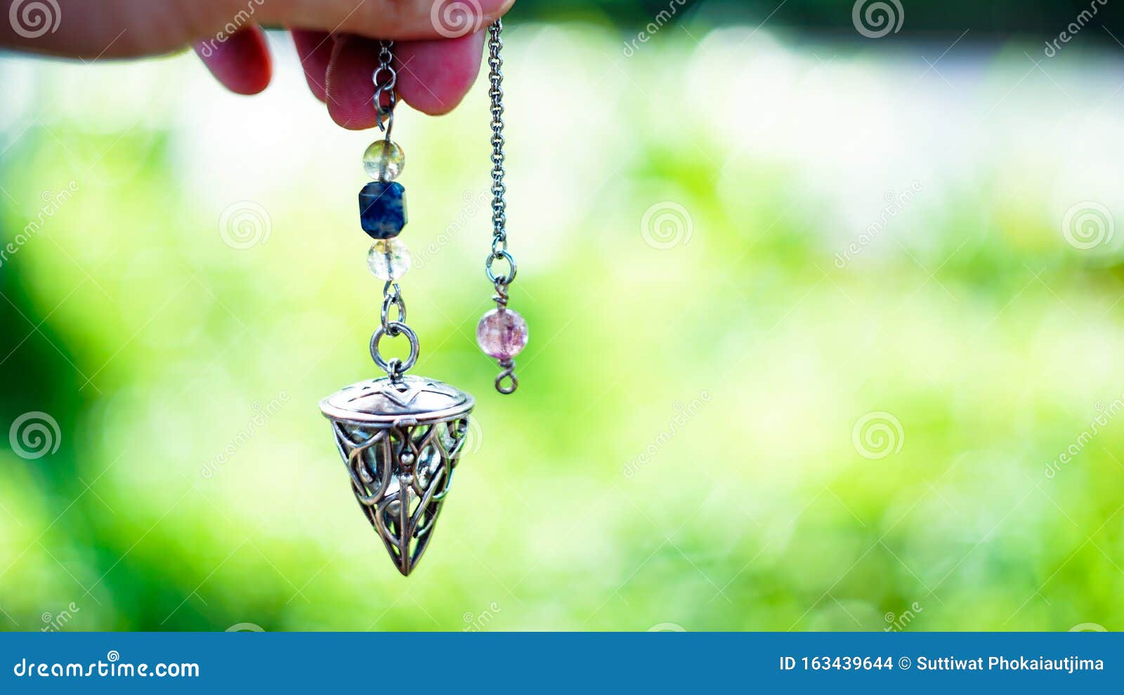 Holding and Using Quartz Crystal Pendulum Stock Photo - Image of ...