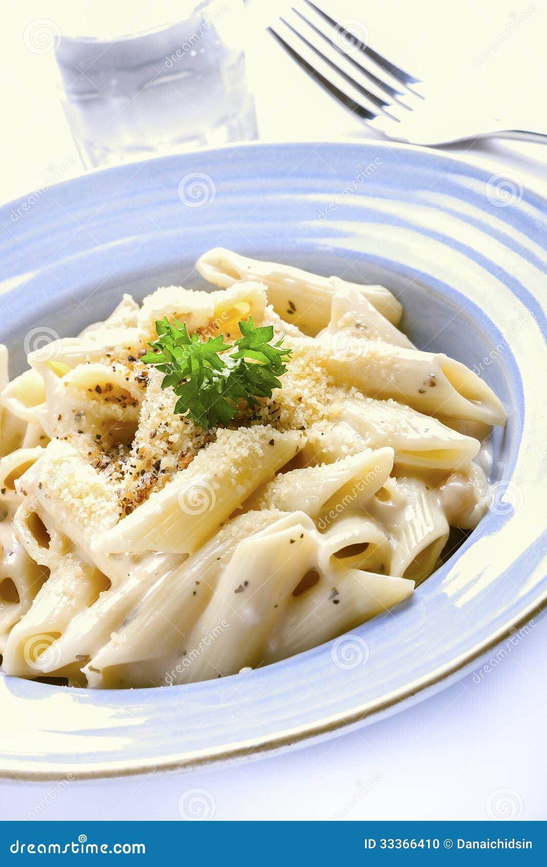 Penne pasta cream sauce stock photo. Image of pasta, fork - 33366410