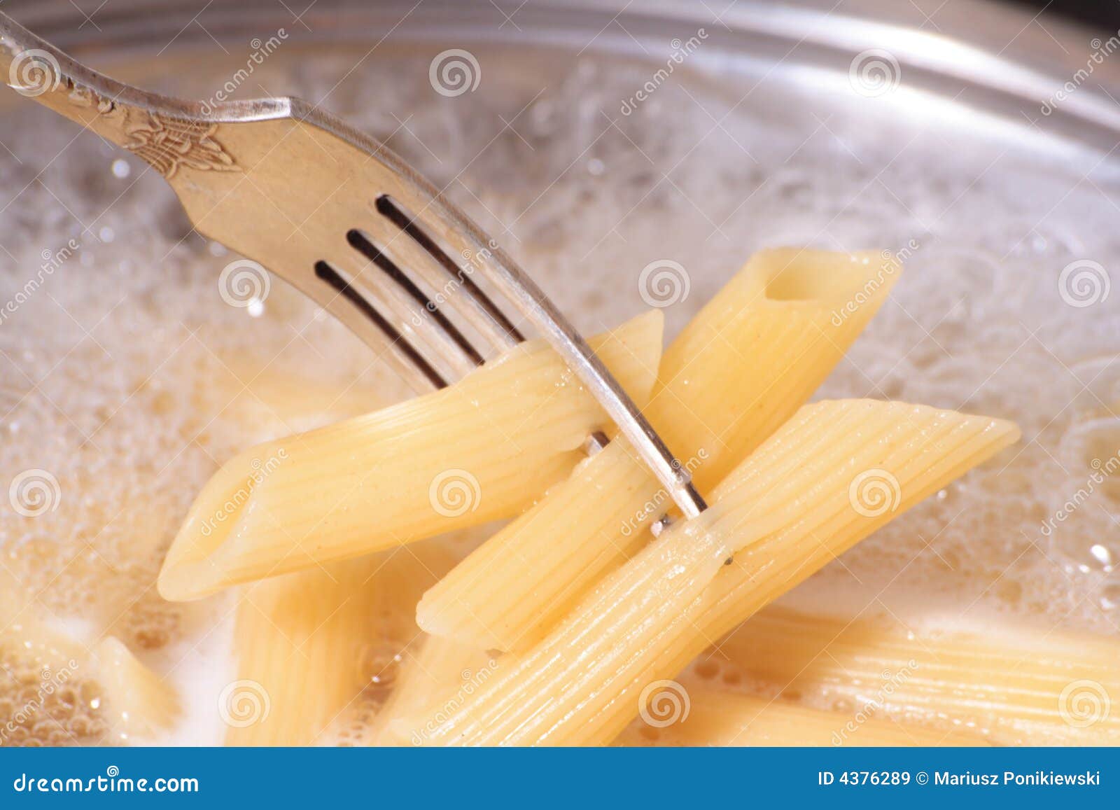 Penne pasta draining stock image. Image of penne, utensil - 4376289