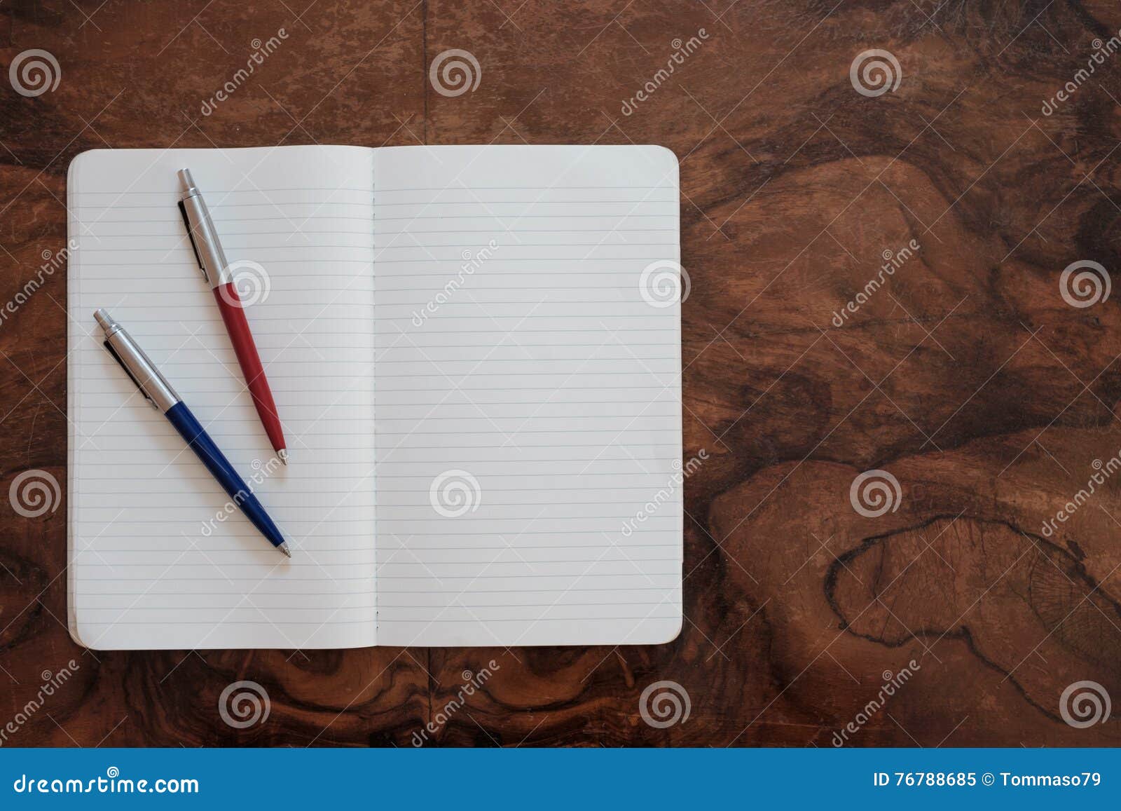 Pens on a Copy Book on Wooden Table Stock Image - Image of horizontal ...