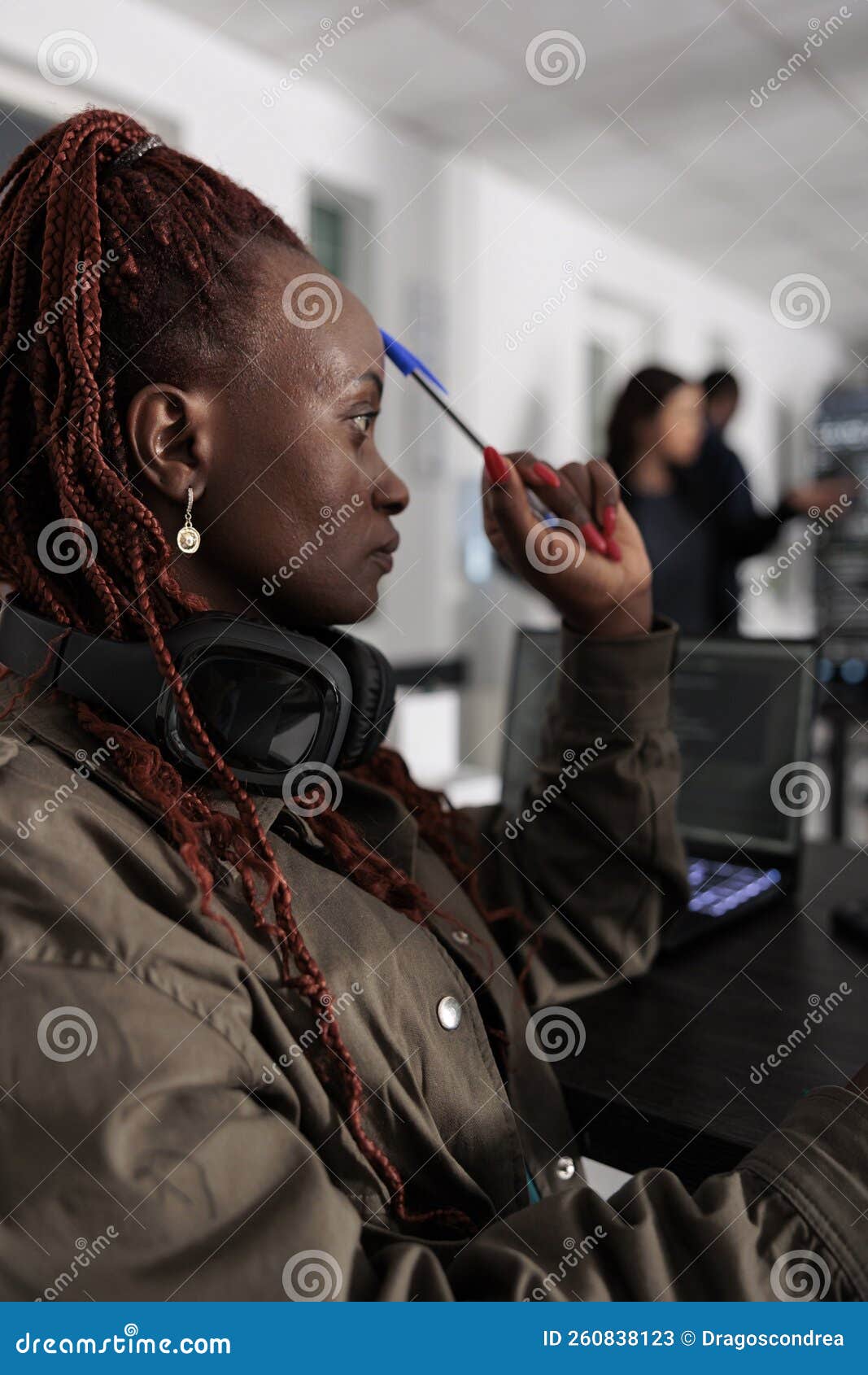 Pensive African American Developer Brainstorming Ideas while Typing ... Pensive African American Developer Brainstorming Ideas while Typing ...