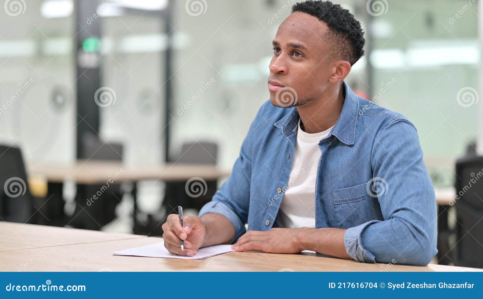 Pensive African Man Doing Paperwork, Writing Stock Photo - Image of ...