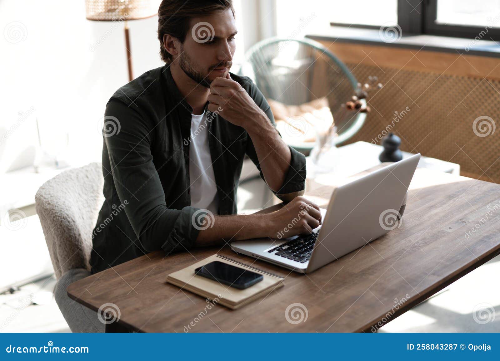 Pensive Bearded Man Sitting at Table Work at Laptop Thinking of Problem ...