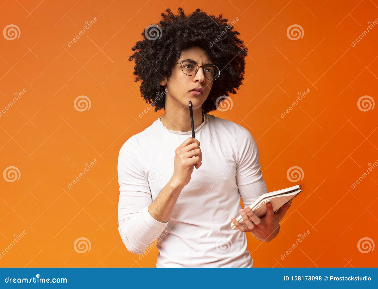 Pensive Black Guy Brainstorming with Notebook and Pencil Stock Photo ...