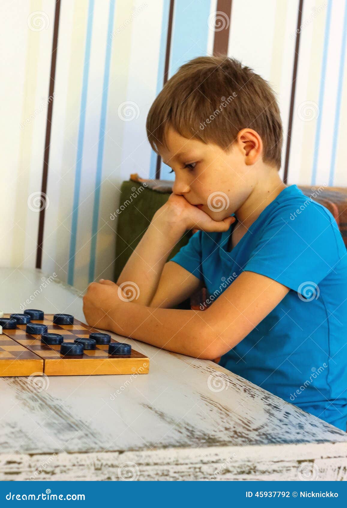 Pensive Boy during a Game of Checkers Stock Photo - Image of pattern ...
