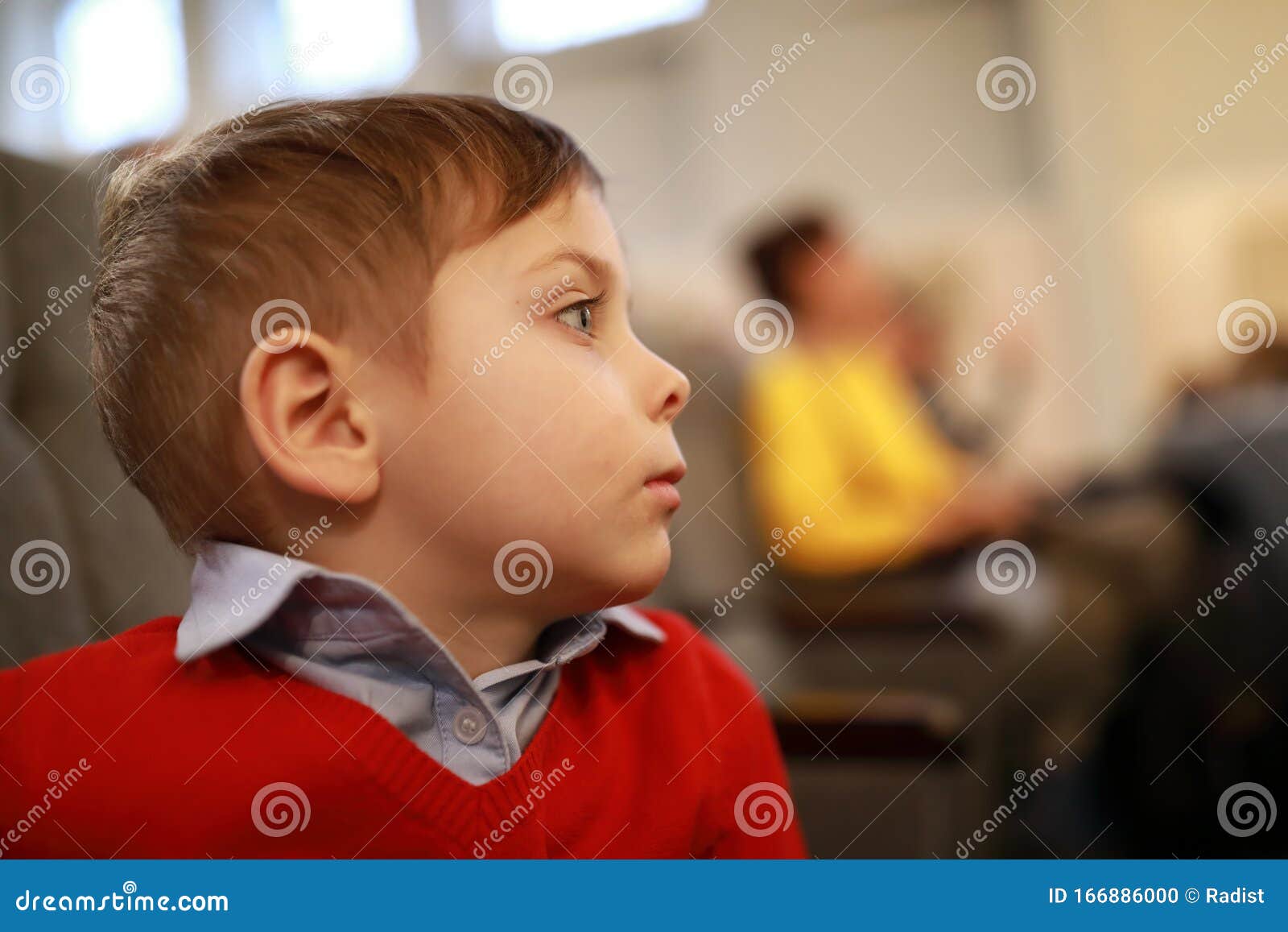 Pensive Boy Watching Performance Stock Photo - Image of interior, male ...