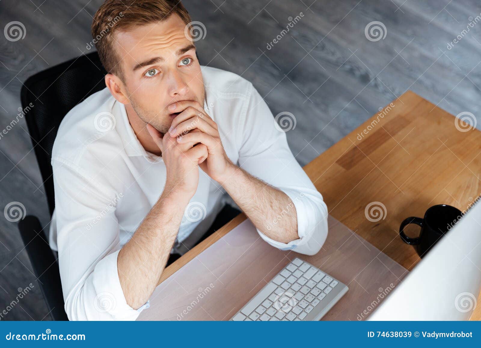 Pensive Businessman Working with Computer and Thinking at Workplace ...