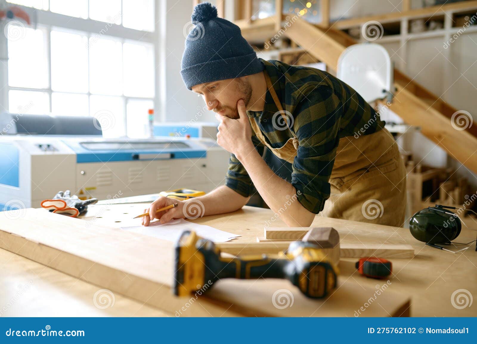 Pensive Carpenter Designer Looking at Plan Scheme on Work Table Stock ...