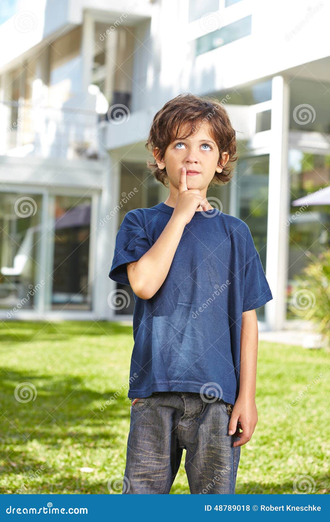 Pensive child in a garden stock photo. Image of child - 48789018