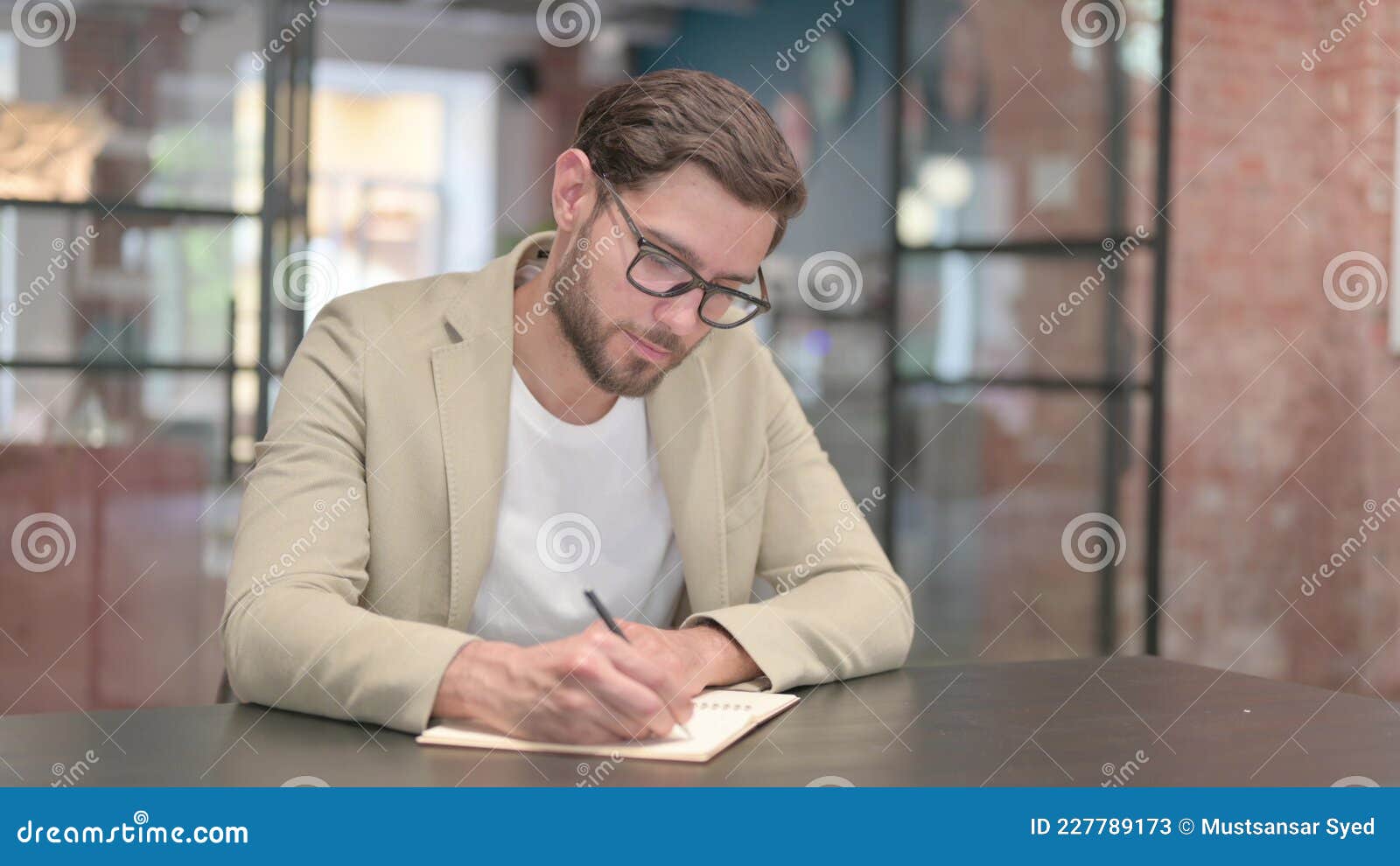 Pensive Young Man Writing on Paper, Thinking Stock Image - Image of ...