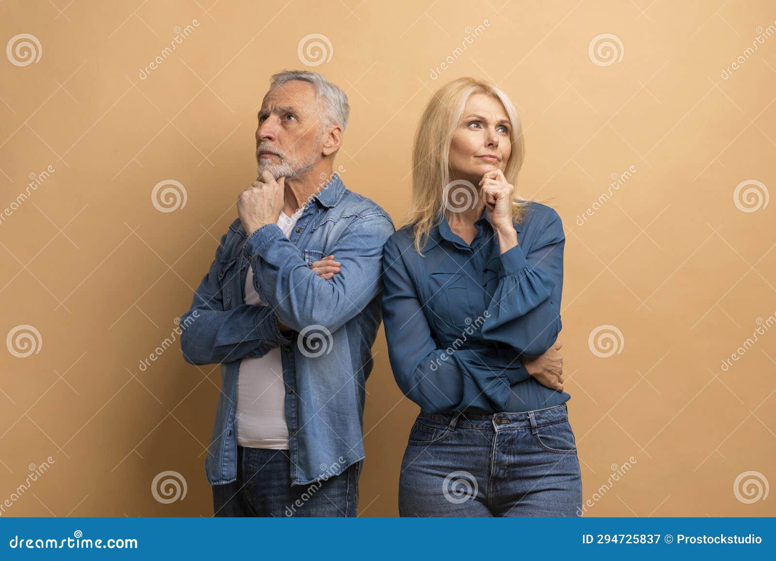 Pensive Elderly Couple Thinking about Something, Beige Background Stock ...