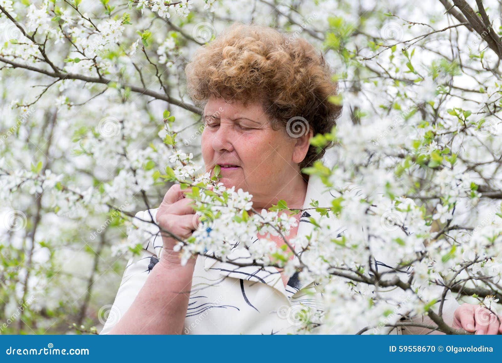 Pensive Elderly Woman in Spring Nature with Cherry Flowers Stock Photo ...