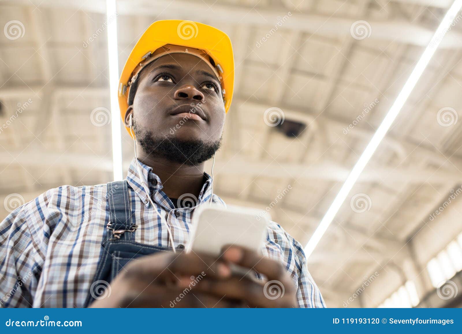 Pensive Engineer Texting Sms at Construction Site Stock Photo - Image ...