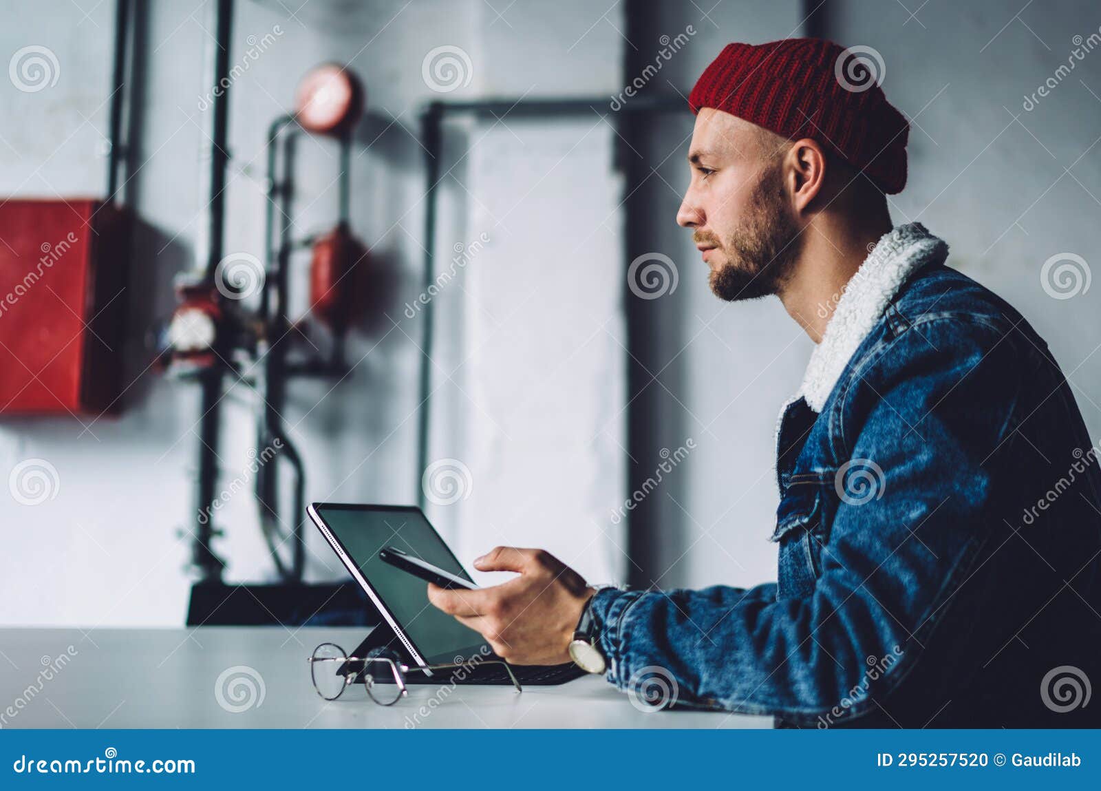 Pensive Freelancer in Office Using Gadgets Stock Photo - Image of ...