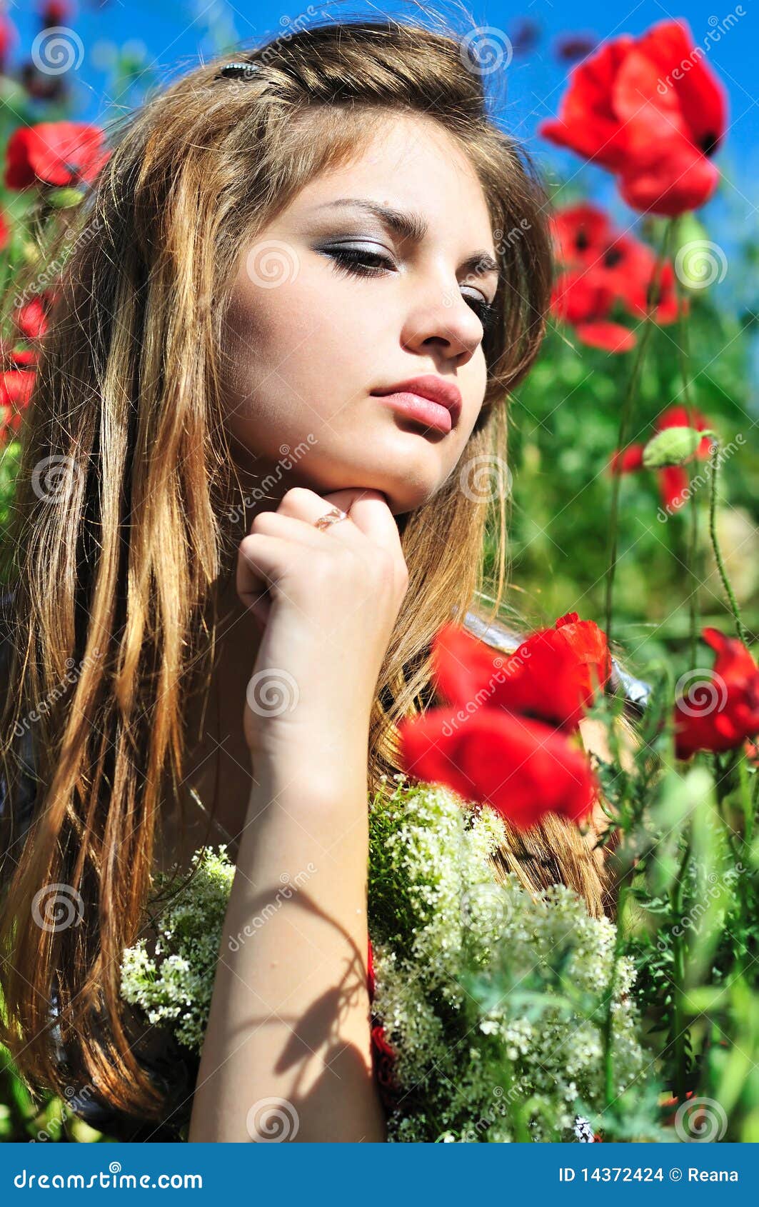 Pensive Girl in Poppy Field Stock Photo - Image of cheerful, green ...
