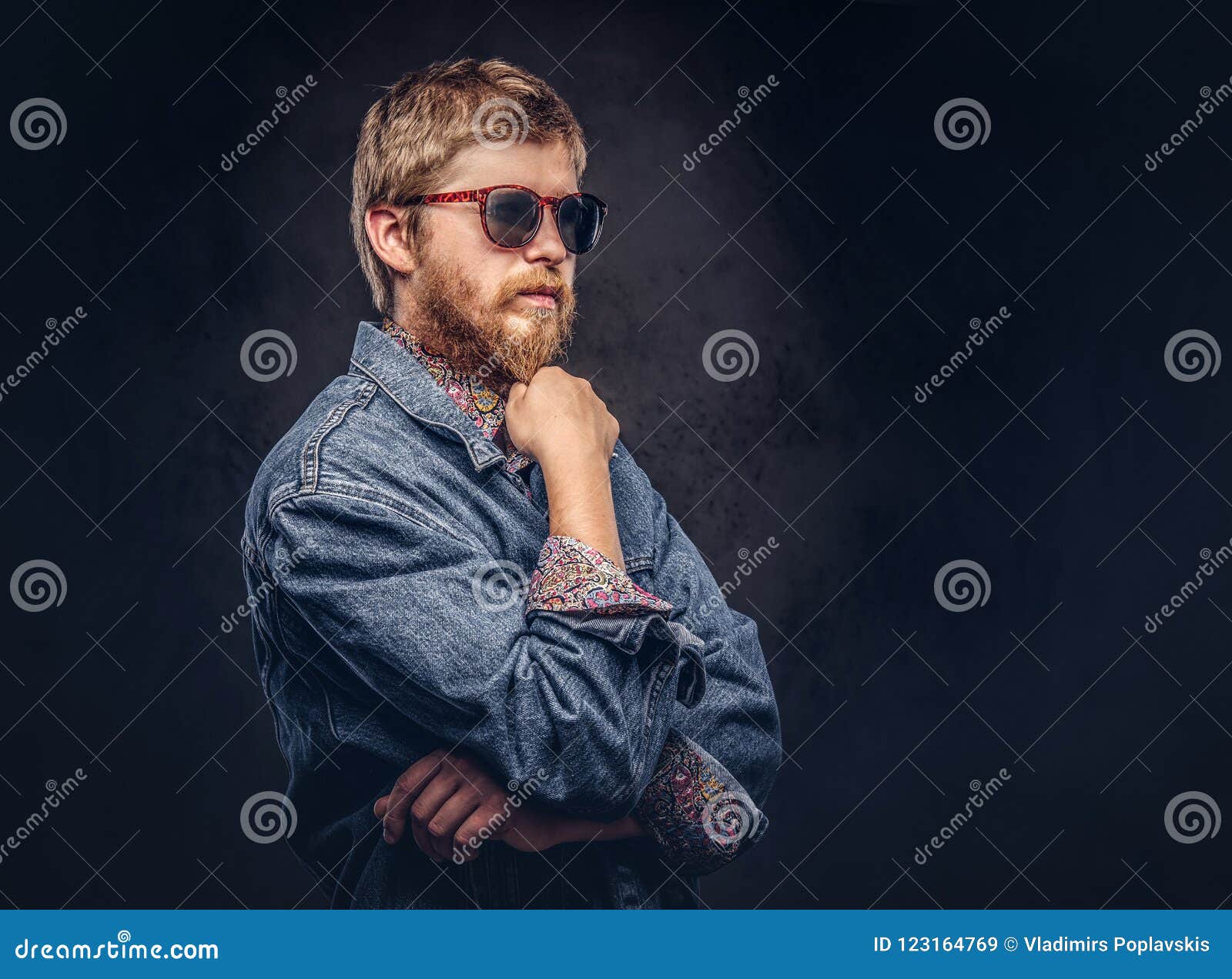 Pensive Hipster Guy Wearing Sunglasses Dressed in Jeans Jacket Posing ... Pensive Hipster Guy Wearing Sunglasses Dressed in Jeans Jacket Posing ...