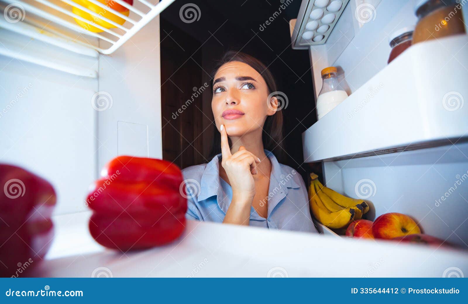 Pensive Housewife Looking into Fridge, View from Inside Stock Photo ...