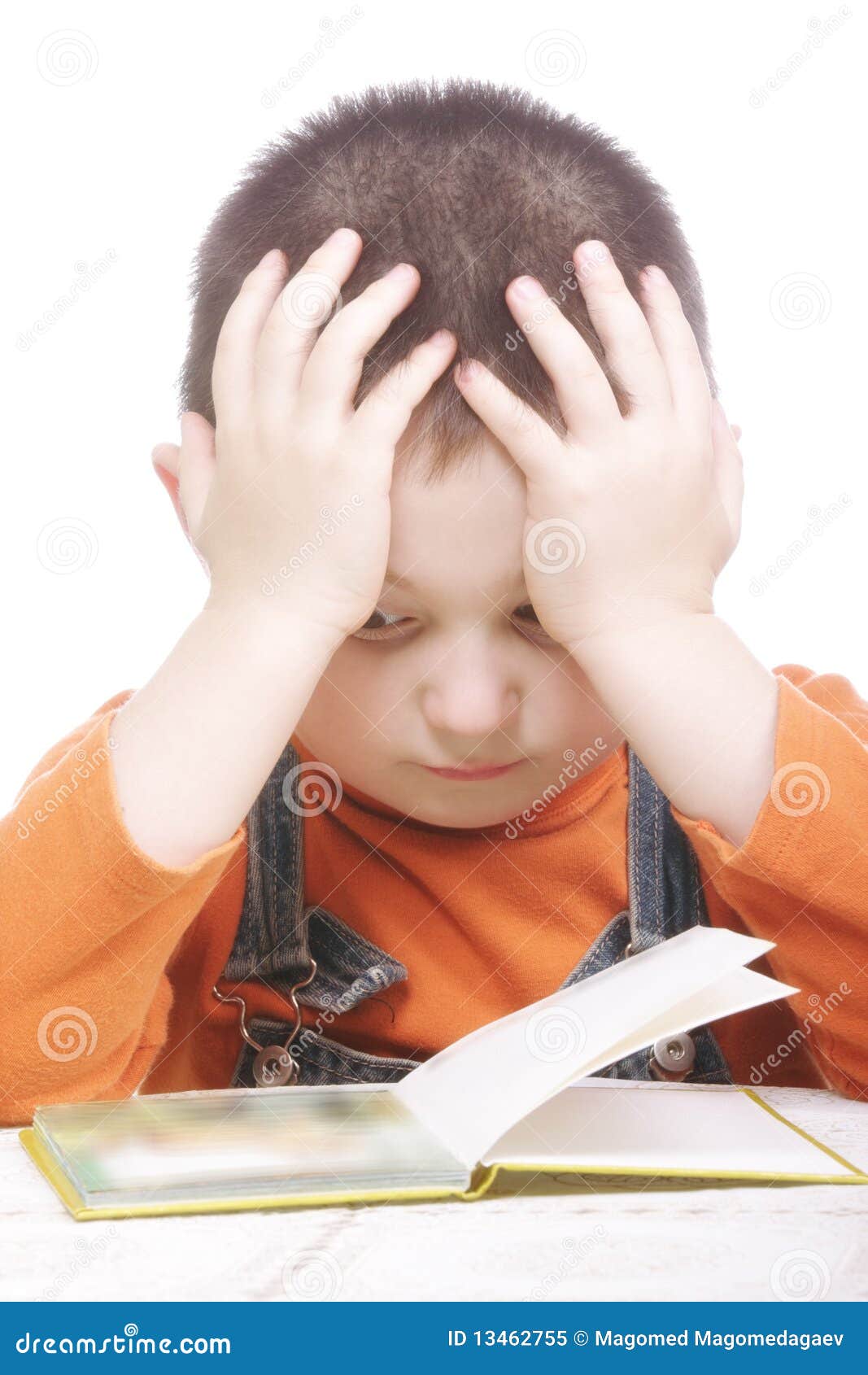 Pensive kid reading book stock image. Image of orange - 13462755