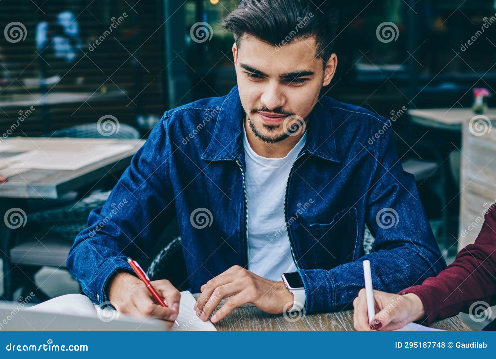 Pensive Male and Female Students Watching Tutorial on Laptop Computer ...