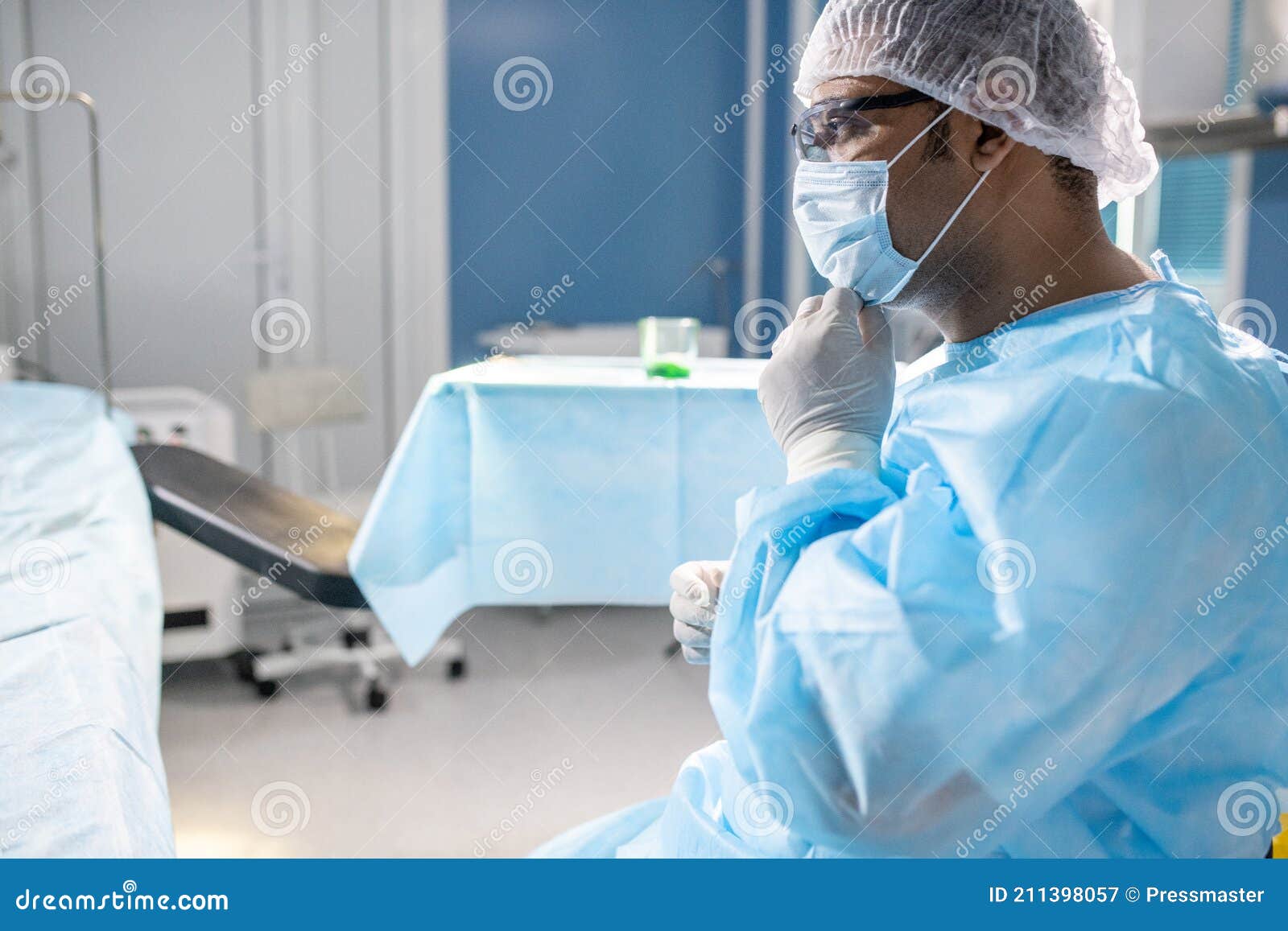 Pensive Male Surgeon in Protective Workwear Sitting in Front of ...