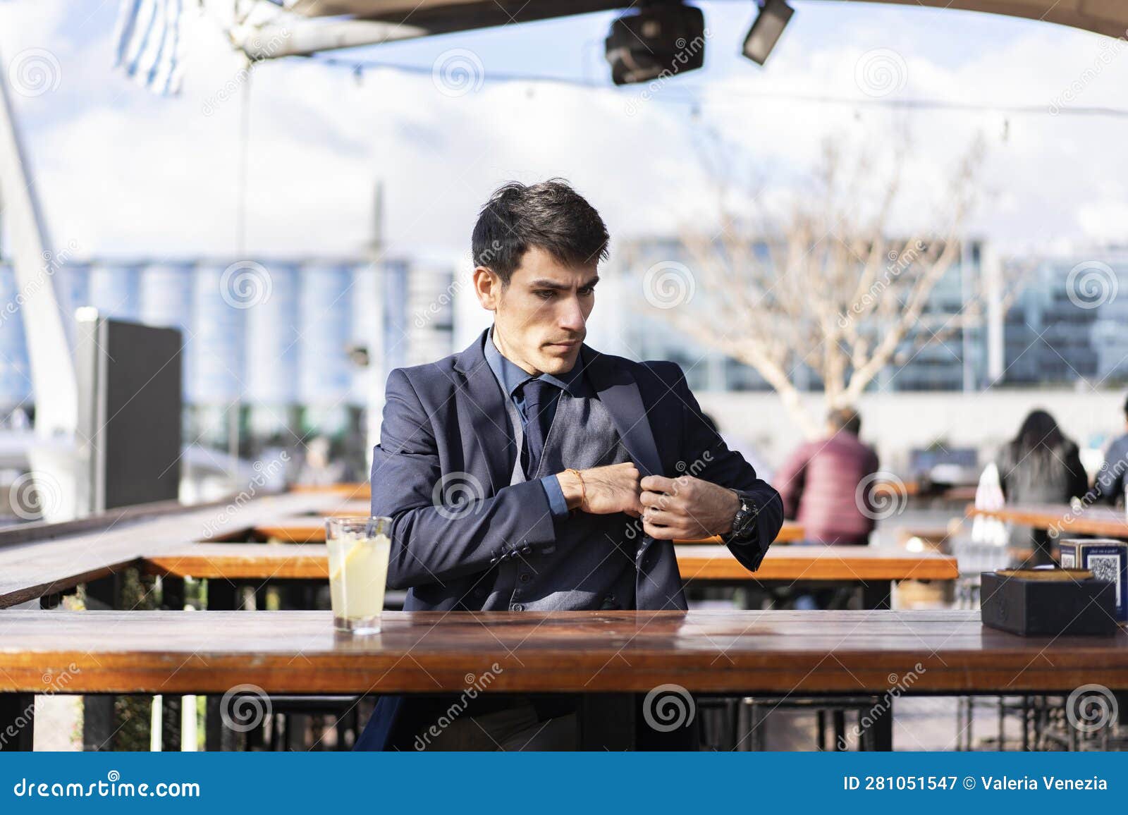 A Pensive Man Looking for His Smartphone in His Pocket To Check ...