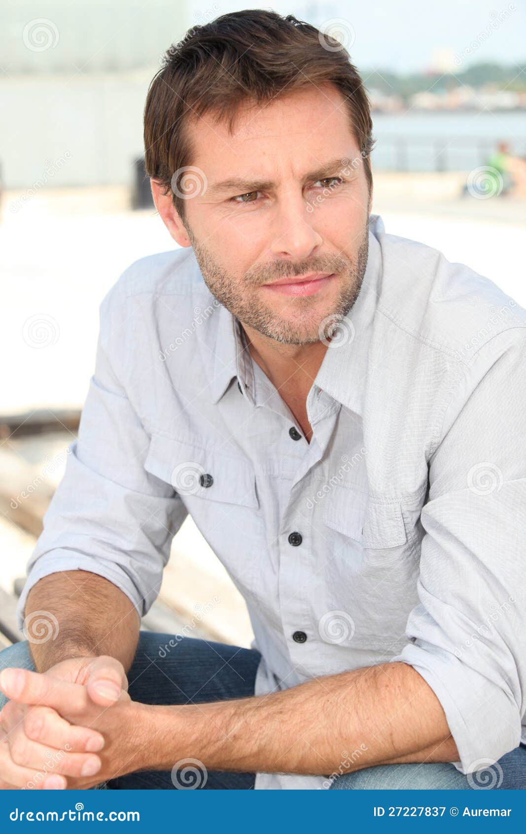 Pensive man sat riverside stock image. Image of enjoy - 27227837