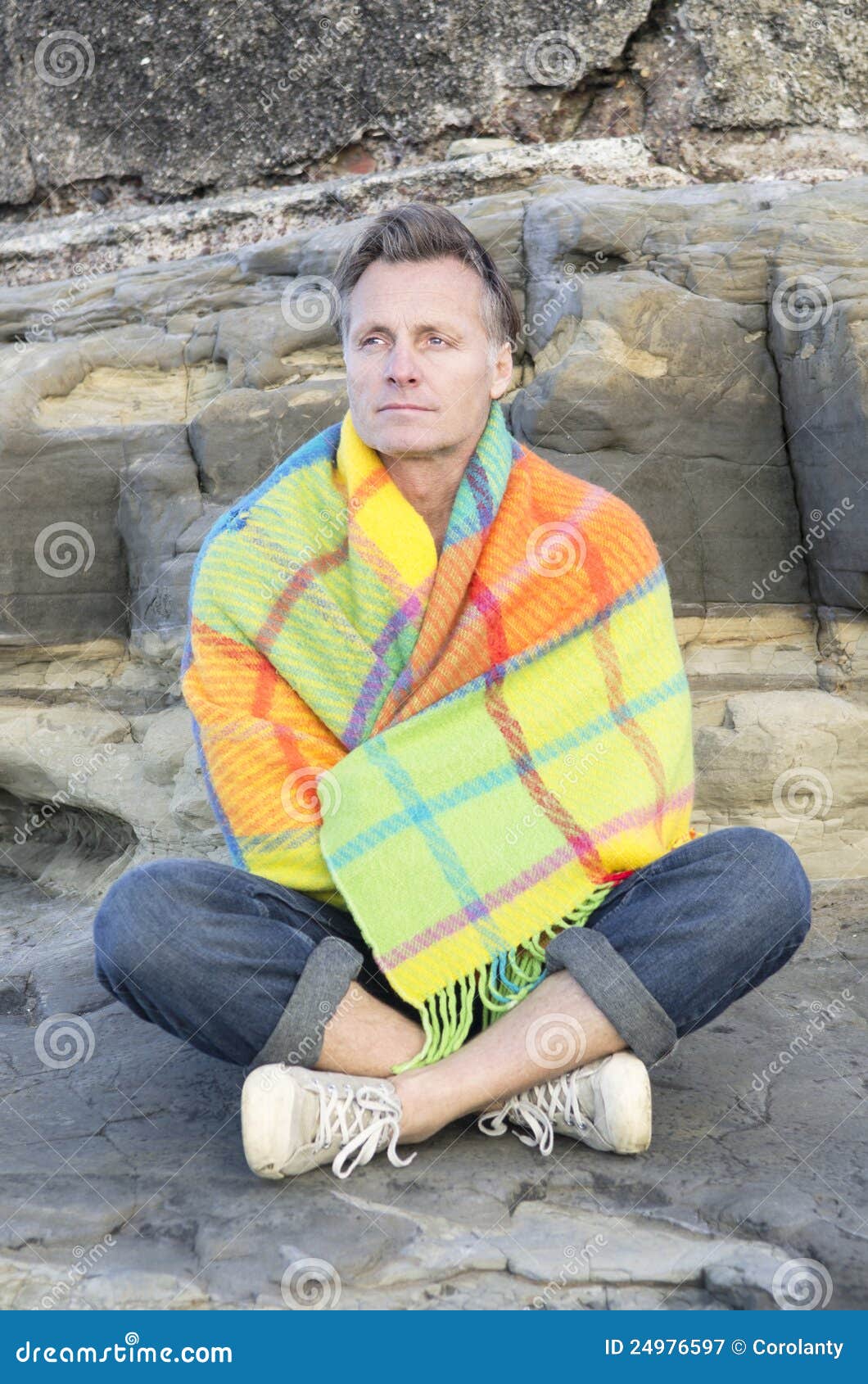 Pensive Man Sitting on a Rock Alone. Stock Image - Image of colorful ...