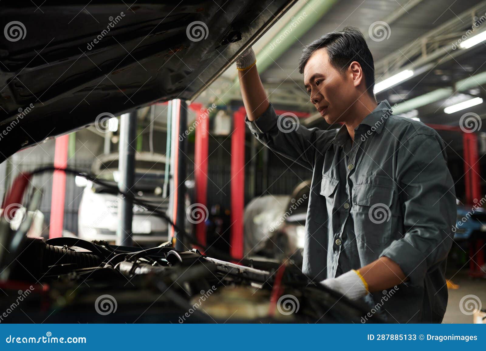 Mechanic Opening Car Hood stock image. Image of worker - 287885133