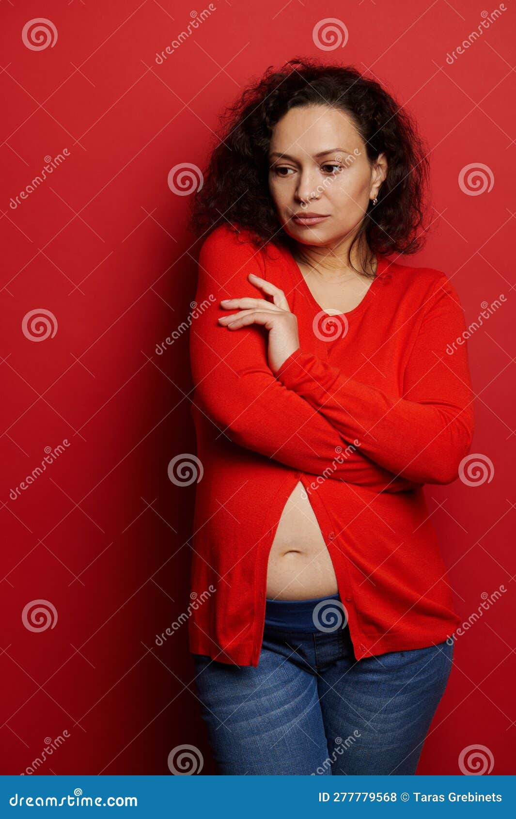 Pensive Multi Ethnic Pregnant Woman Looking Serious Posing With Folded