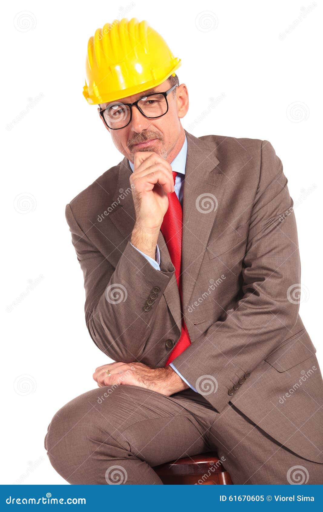 Engineer Sitting Placing Safety Hard Hat On The Table Coffee Cup Pen ...