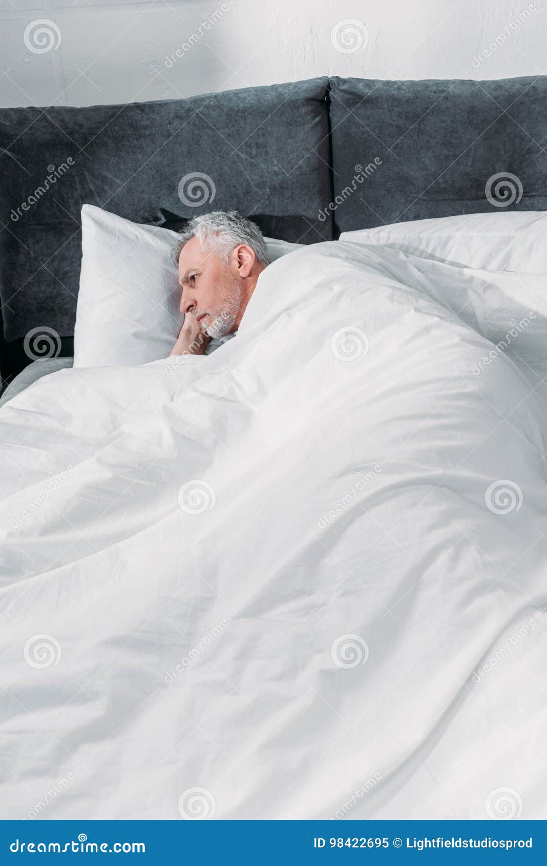 Pensive Senior Man Lying in Bed at Home Stock Image - Image of pensive ...