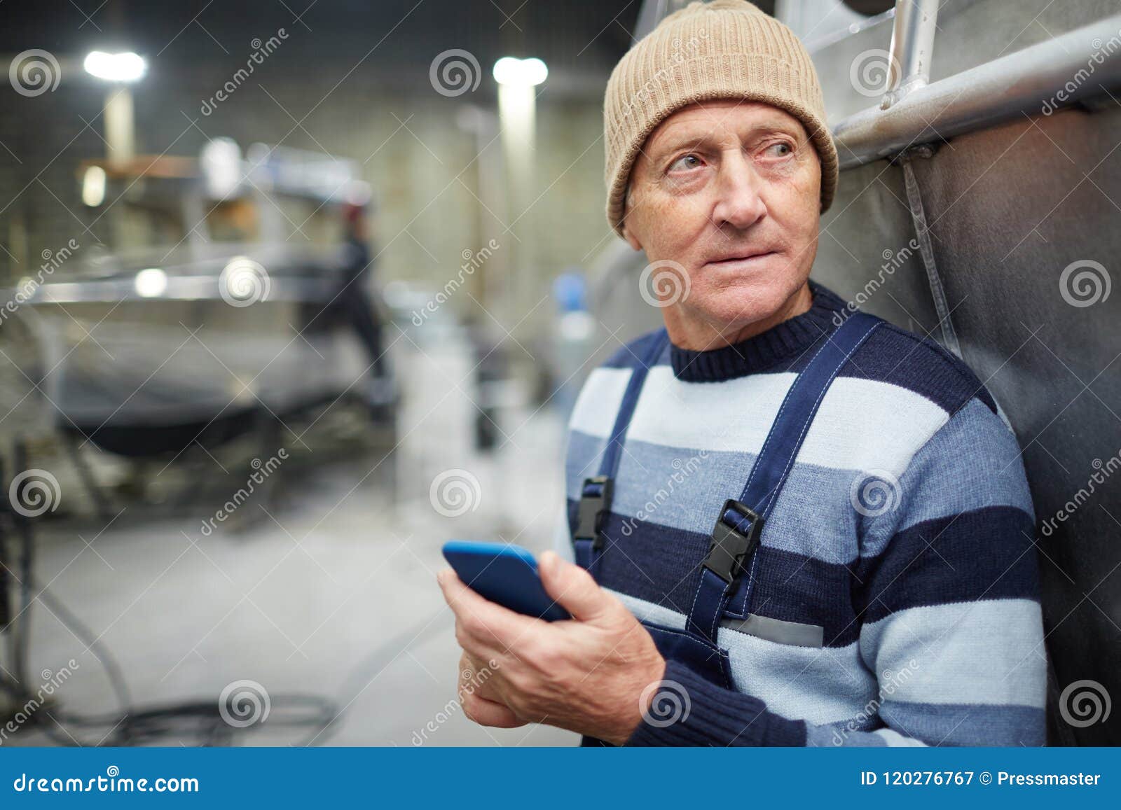 Engineer with smartphone stock image. Image of indoor - 120276767
