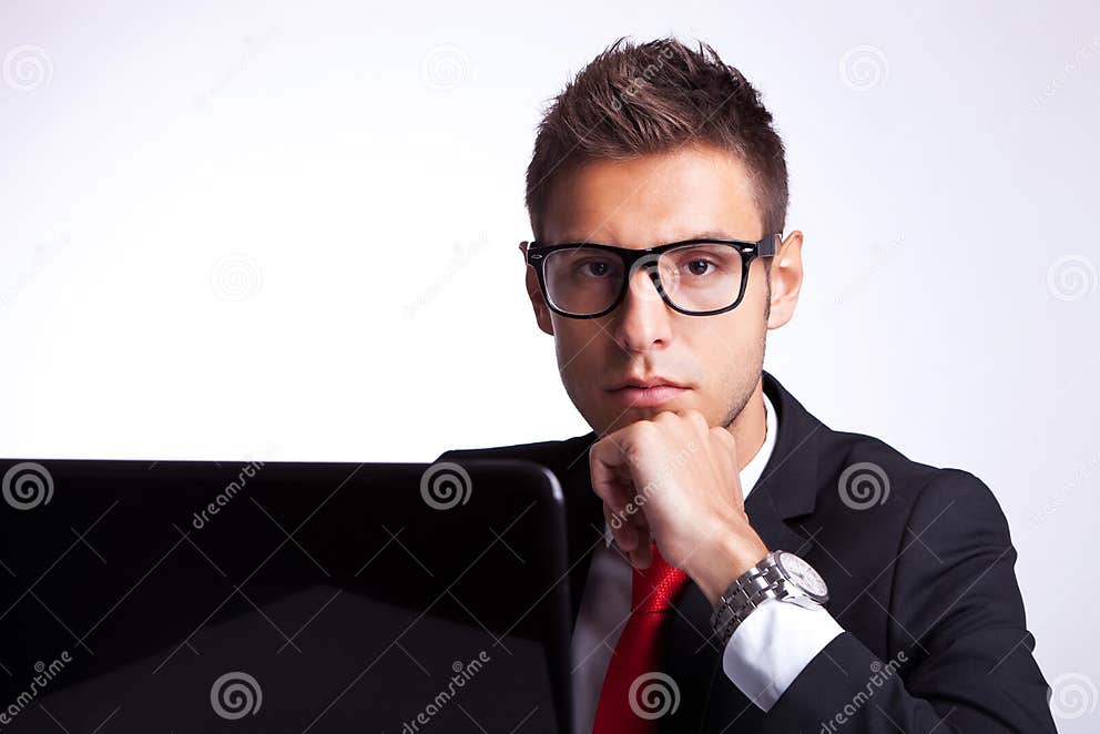 Pensive Serious Business Man at Desk Stock Image - Image of internet ... Pensive Serious Business Man at Desk Stock Image - Image of internet ...