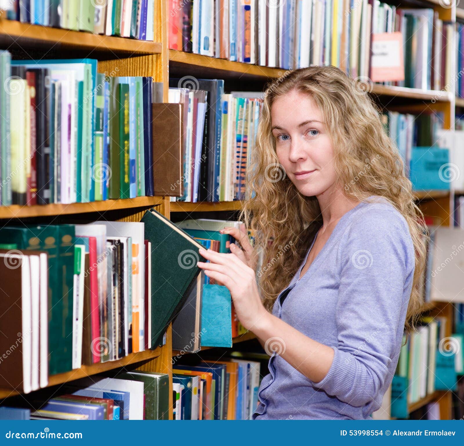 Pensive Student in the Library Surrounded by Books Stock Photo - Image ...