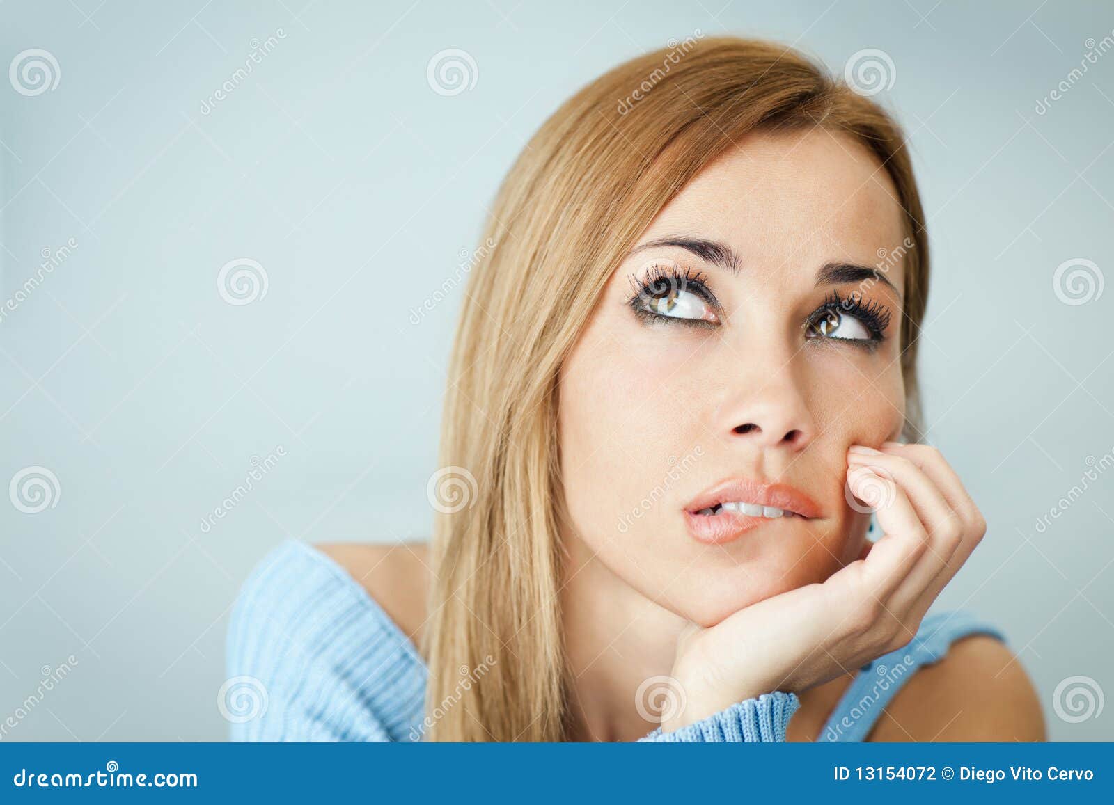 Pensive woman biting lips stock photo. Image of person - 13154072