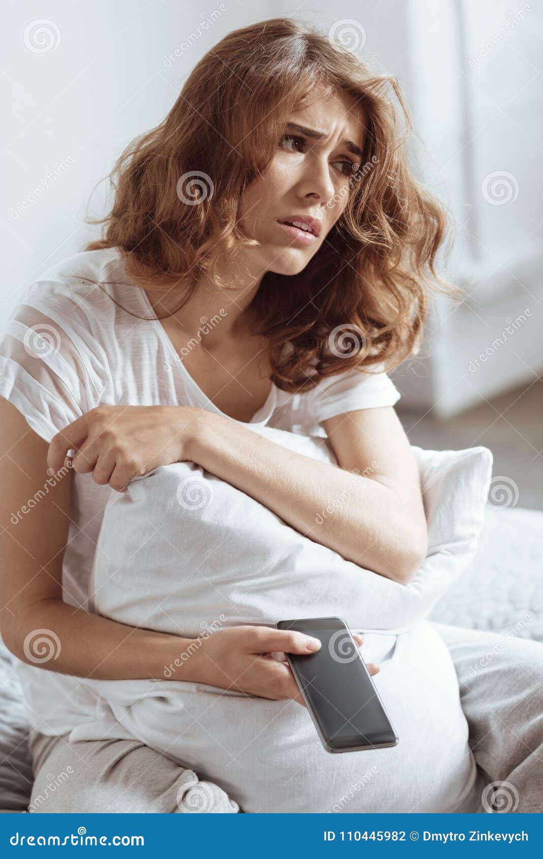 Pensive Woman Grimacing While Thinking About Something Depressing Stock