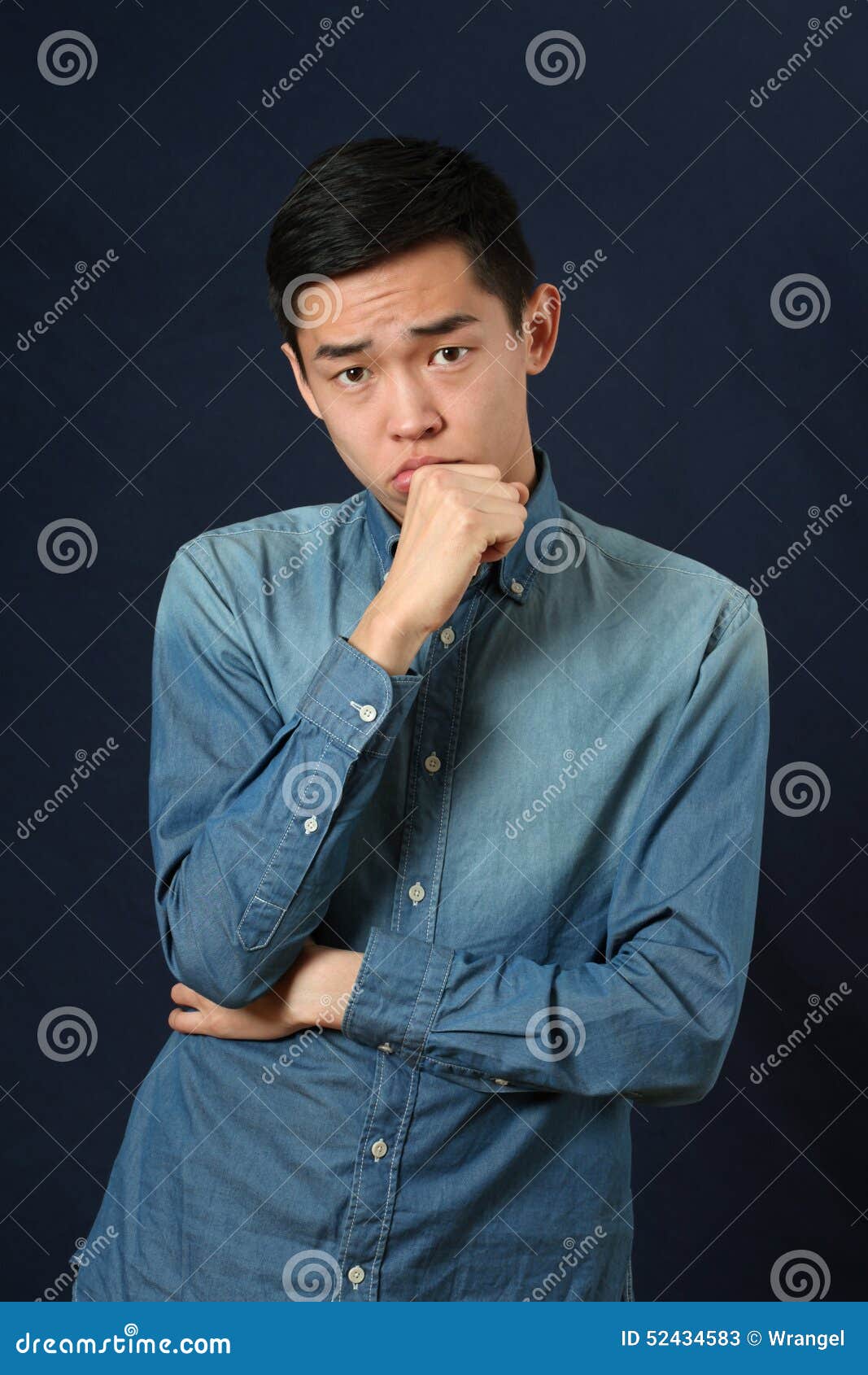 Pensive Young Asian Man Looking at Camera Stock Image - Image of ...