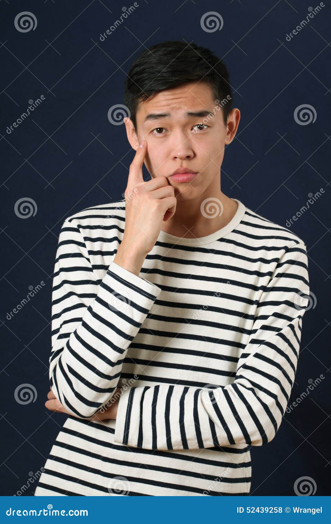 Pensive Young Asian Man Looking at Camera Stock Photo - Image of ...
