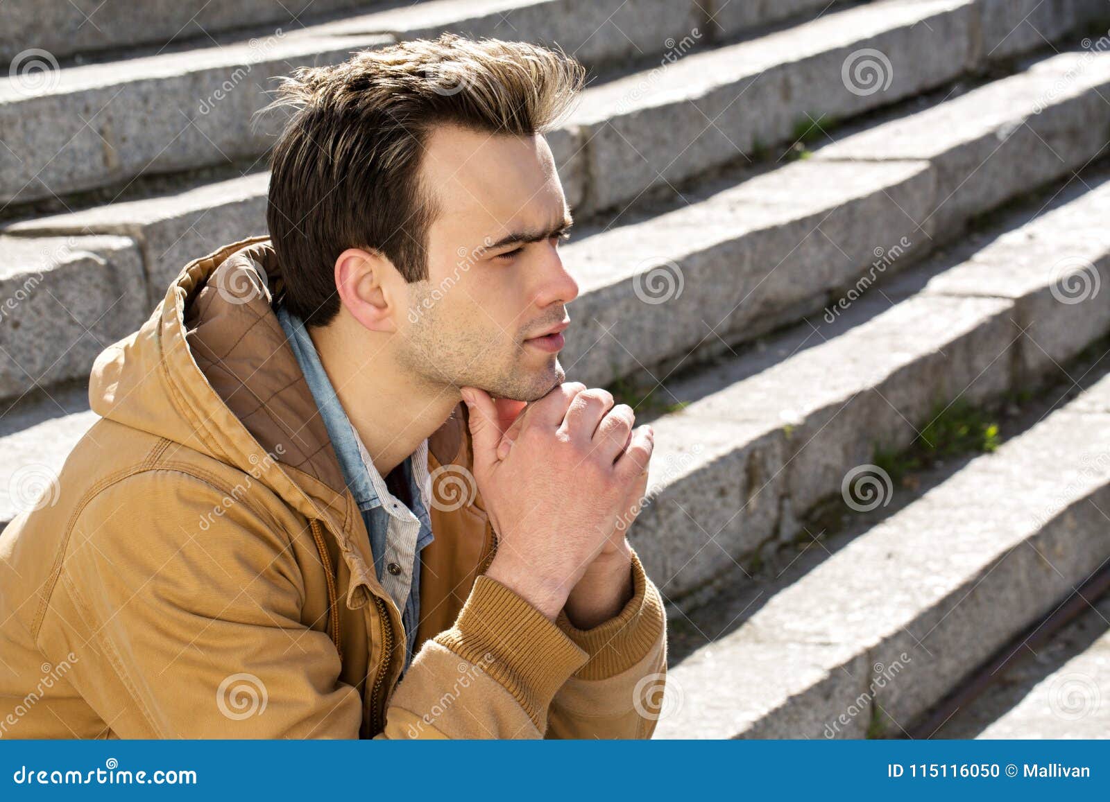 Pensive guy on the steps stock photo. Image of pensive - 115116050