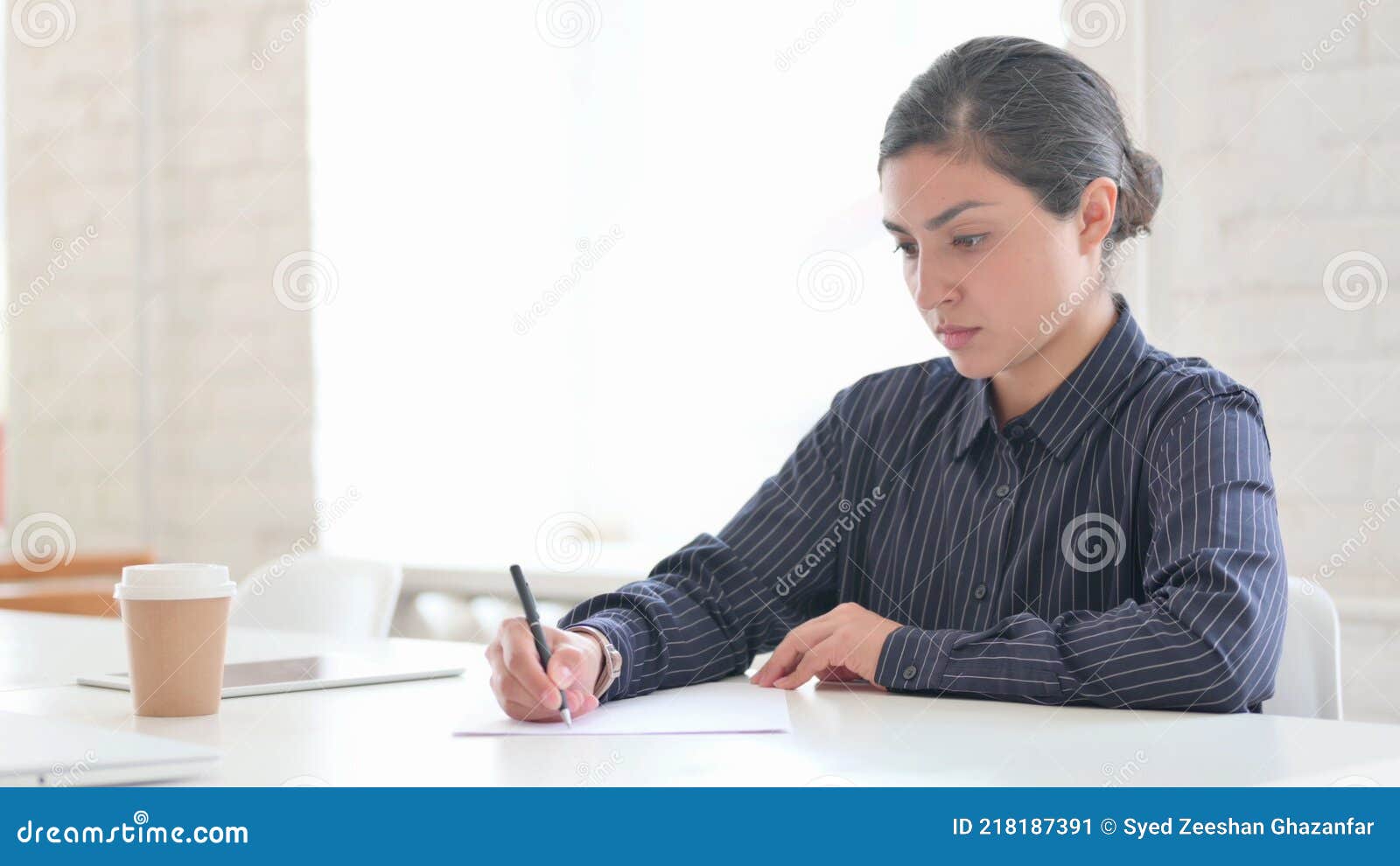 Pensive Young Indian Woman Writing on Paper Stock Image - Image of ...